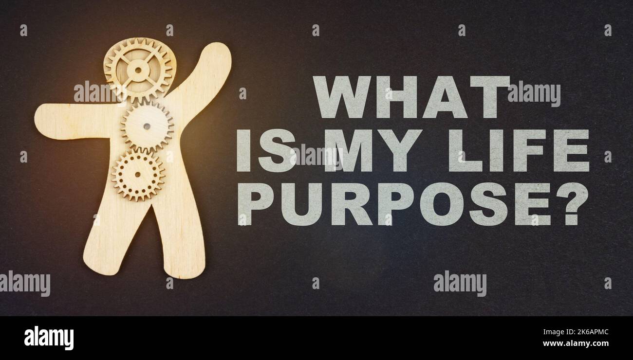 Business concept. On a black background, the figure of a man and gears ...