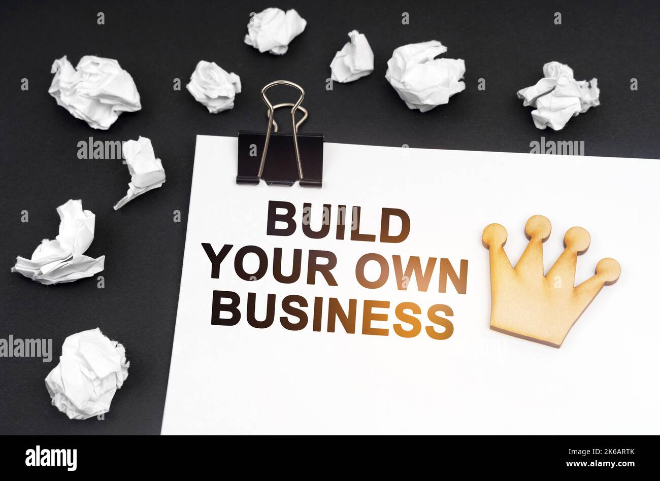 Business and finance concept. On a black background, crumpled paper and ...