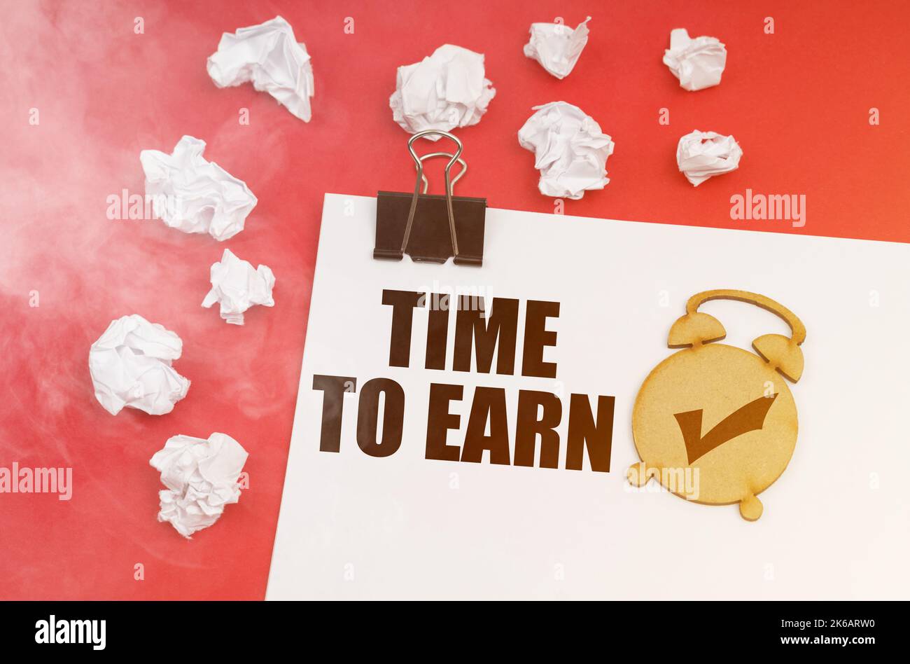 Business and finance concept. On a red background in smoke, crumpled ...