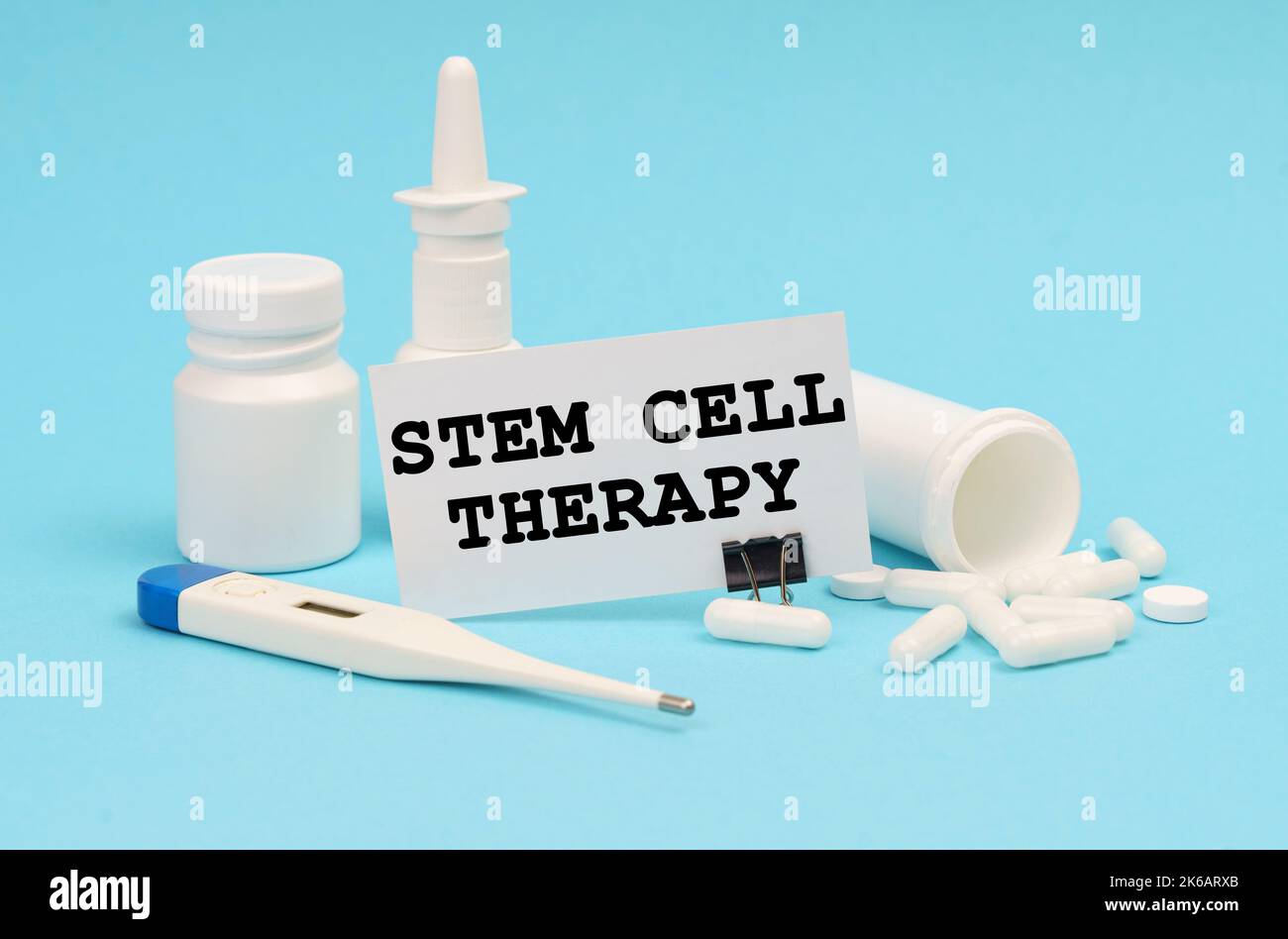 Medicine concept. On a blue background, a thermometer, pills and a ...