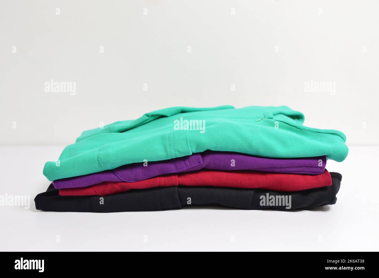 Stack of clothing on a white background isolation Stock Photo - Alamy