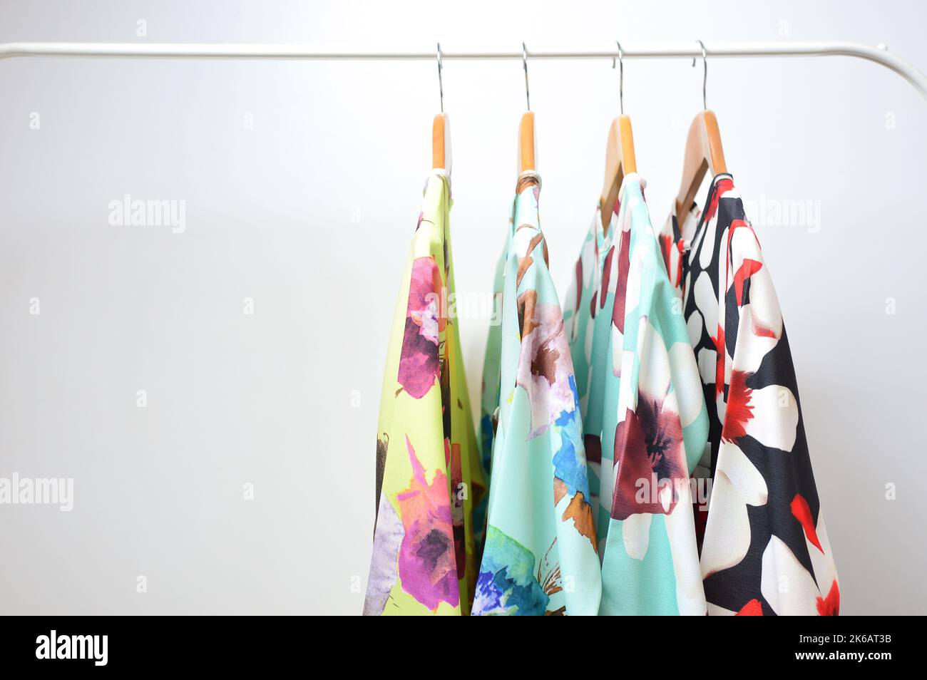 Rack with stylish women's clothes indoors. Modern interior design Stock ...