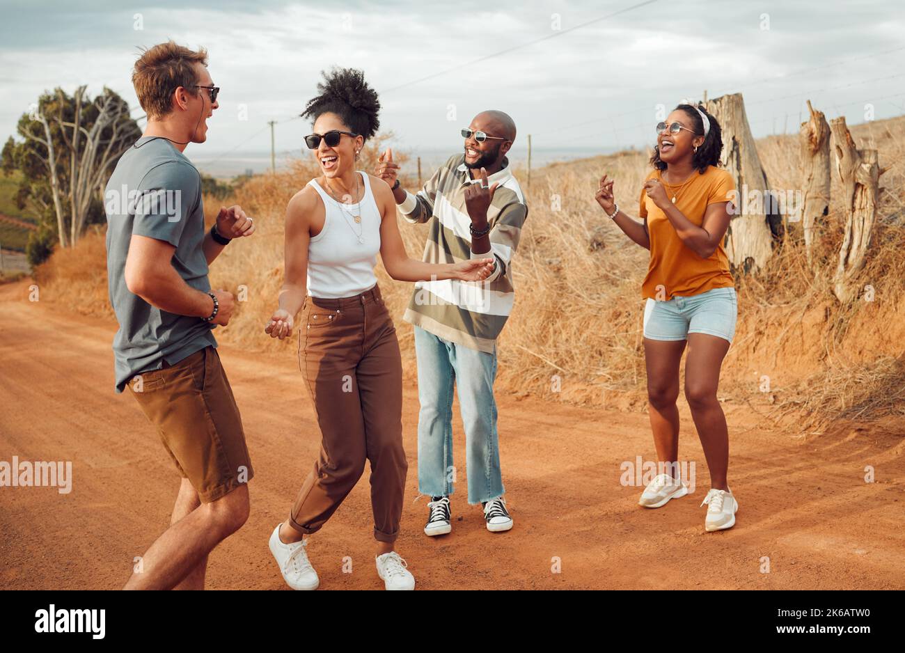 Friends, dance and nature with a man and woman group having fun outdoor ...