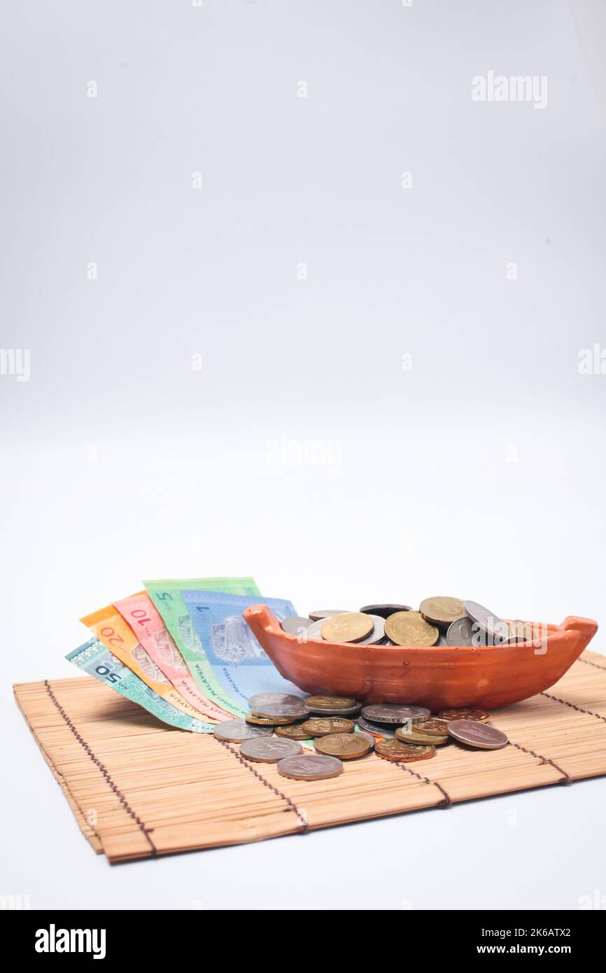 Malaysia Ringgit note and coins isolated on white background. Business ...