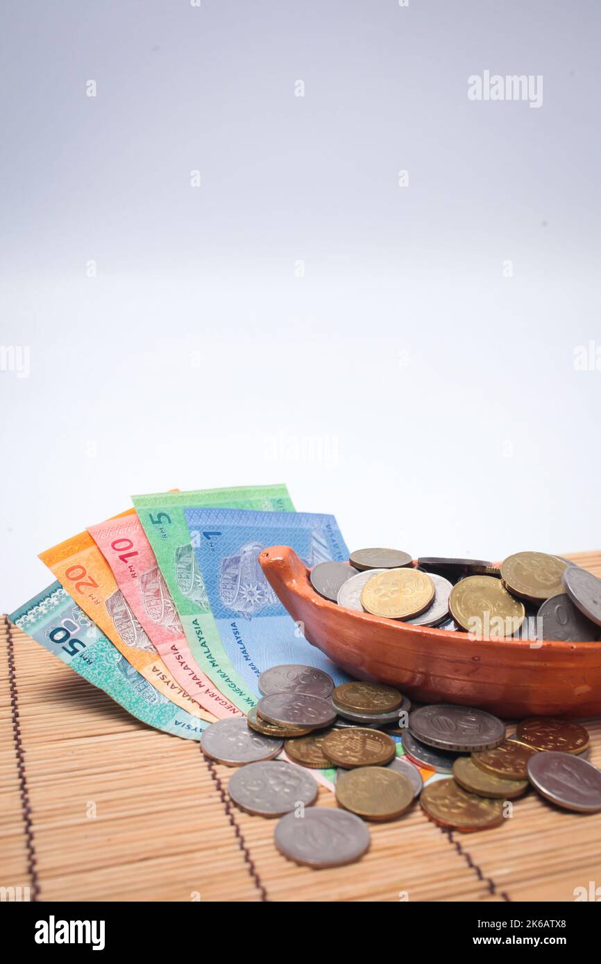 Malaysia Ringgit note and coins isolated on white background. Business ...