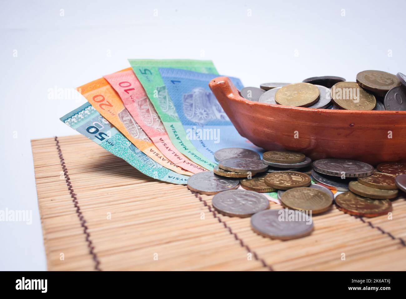 Malaysia Ringgit note and coins isolated on white background. Business ...