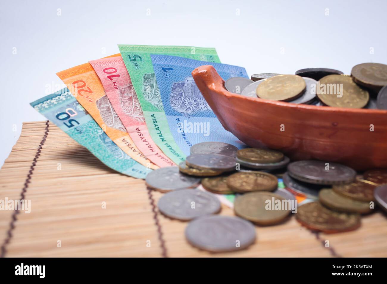 Malaysia Ringgit note and coins isolated on white background. Business ...