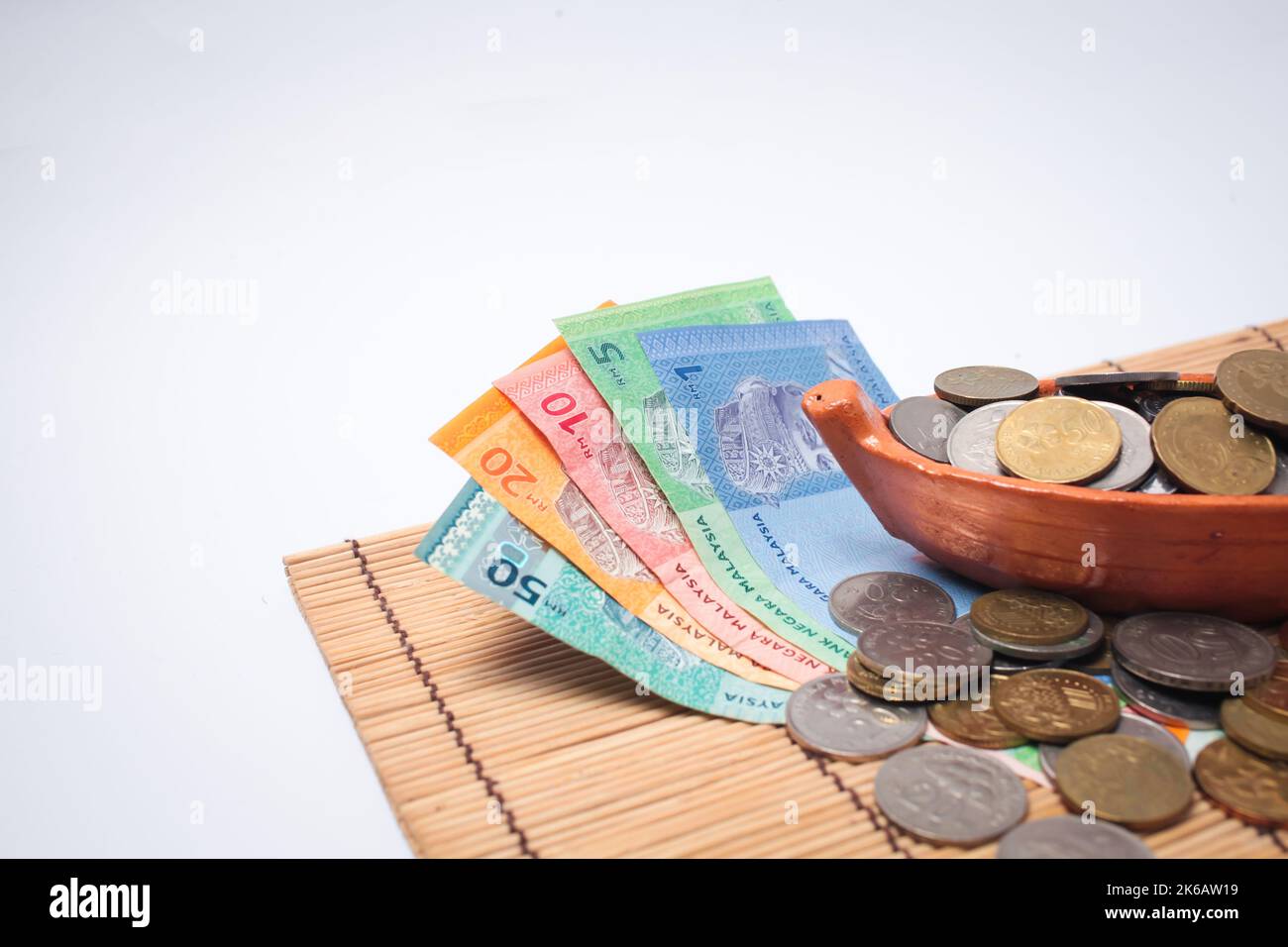 Malaysia Ringgit note and coins isolated on white background. Business ...