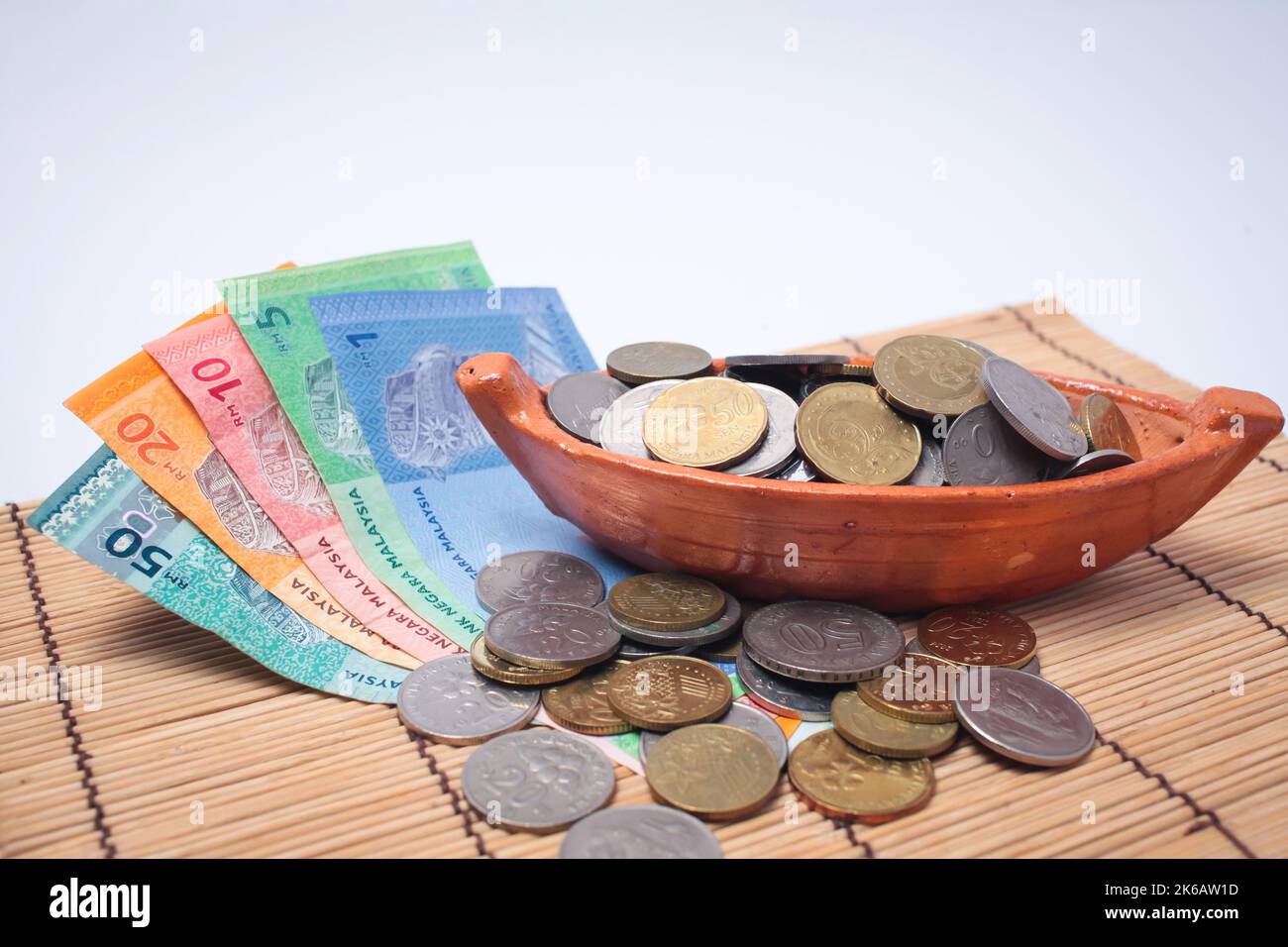 Malaysia Ringgit note and coins isolated on white background. Business ...