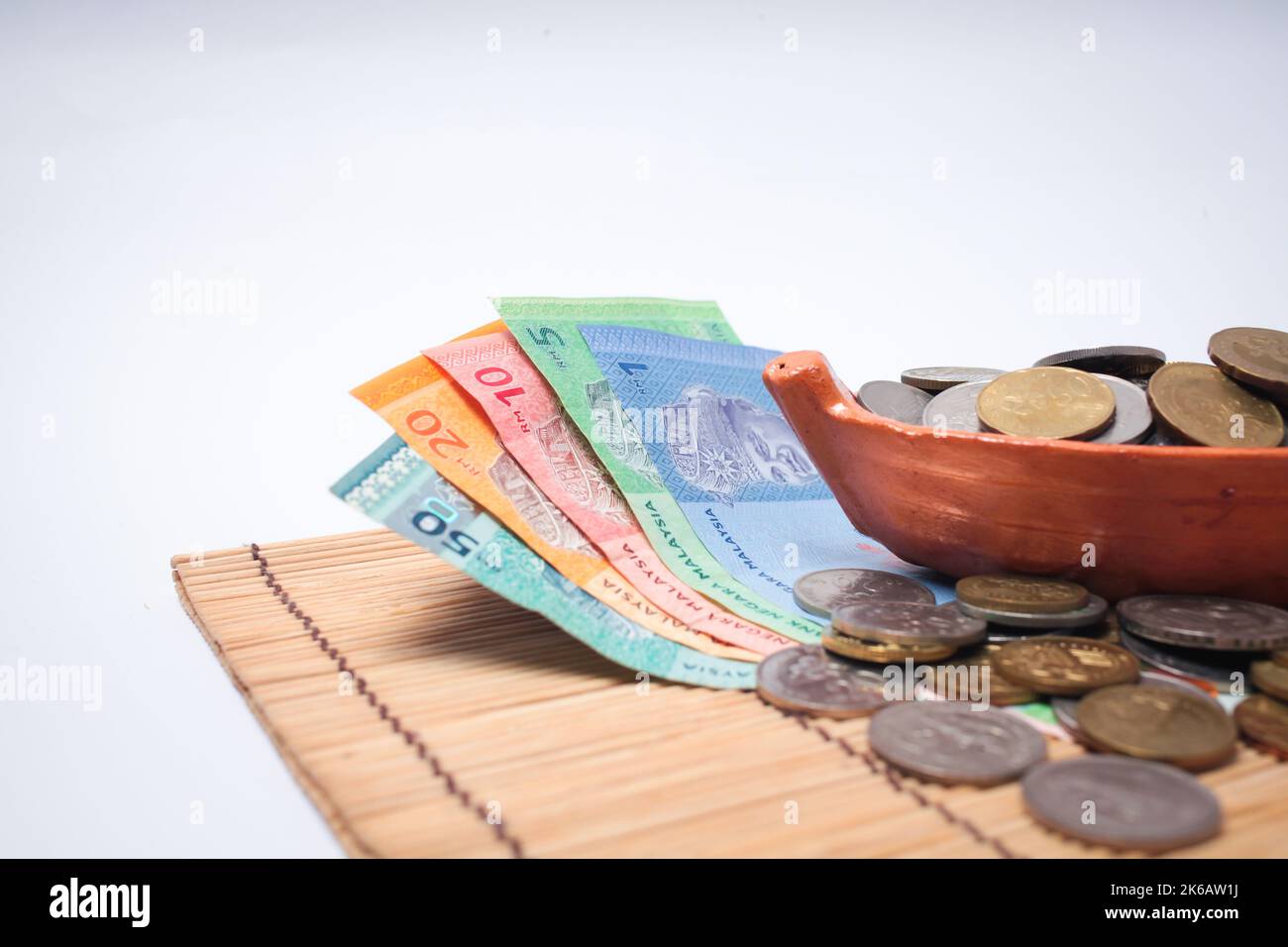 Malaysia Ringgit note and coins isolated on white background. Business ...