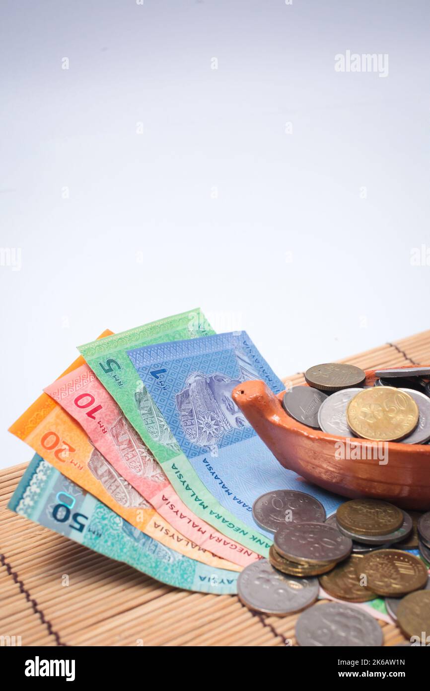 Malaysia Ringgit note and coins isolated on white background. Business ...