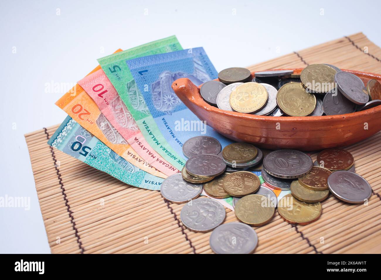 Malaysia Ringgit note and coins isolated on white background. Business ...