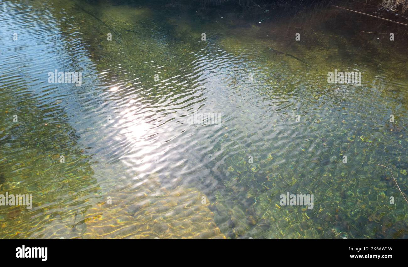 Sea transparent water on underwater turquoise pebbles background ...