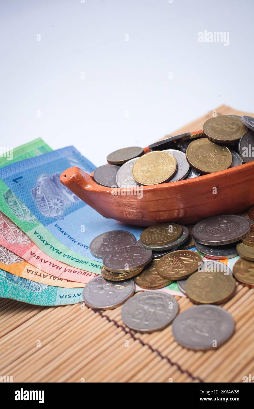 Malaysia Ringgit note and coins isolated on white background. Business ...