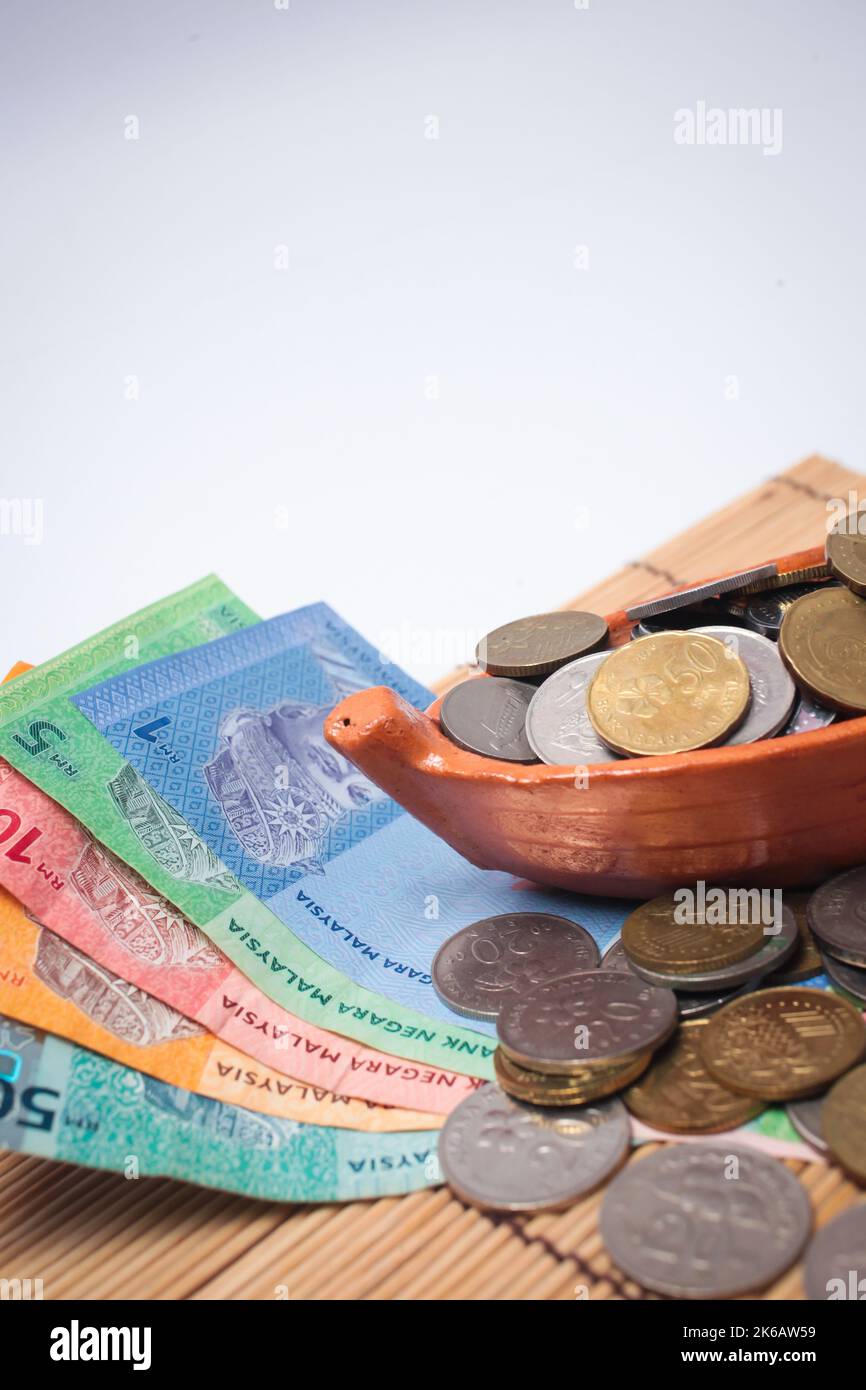 Malaysia Ringgit note and coins isolated on white background. Business ...