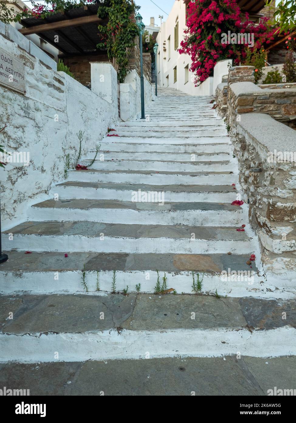 Greece, Tinos island, Cyclades. Whitewashed buildings, stone paved ...