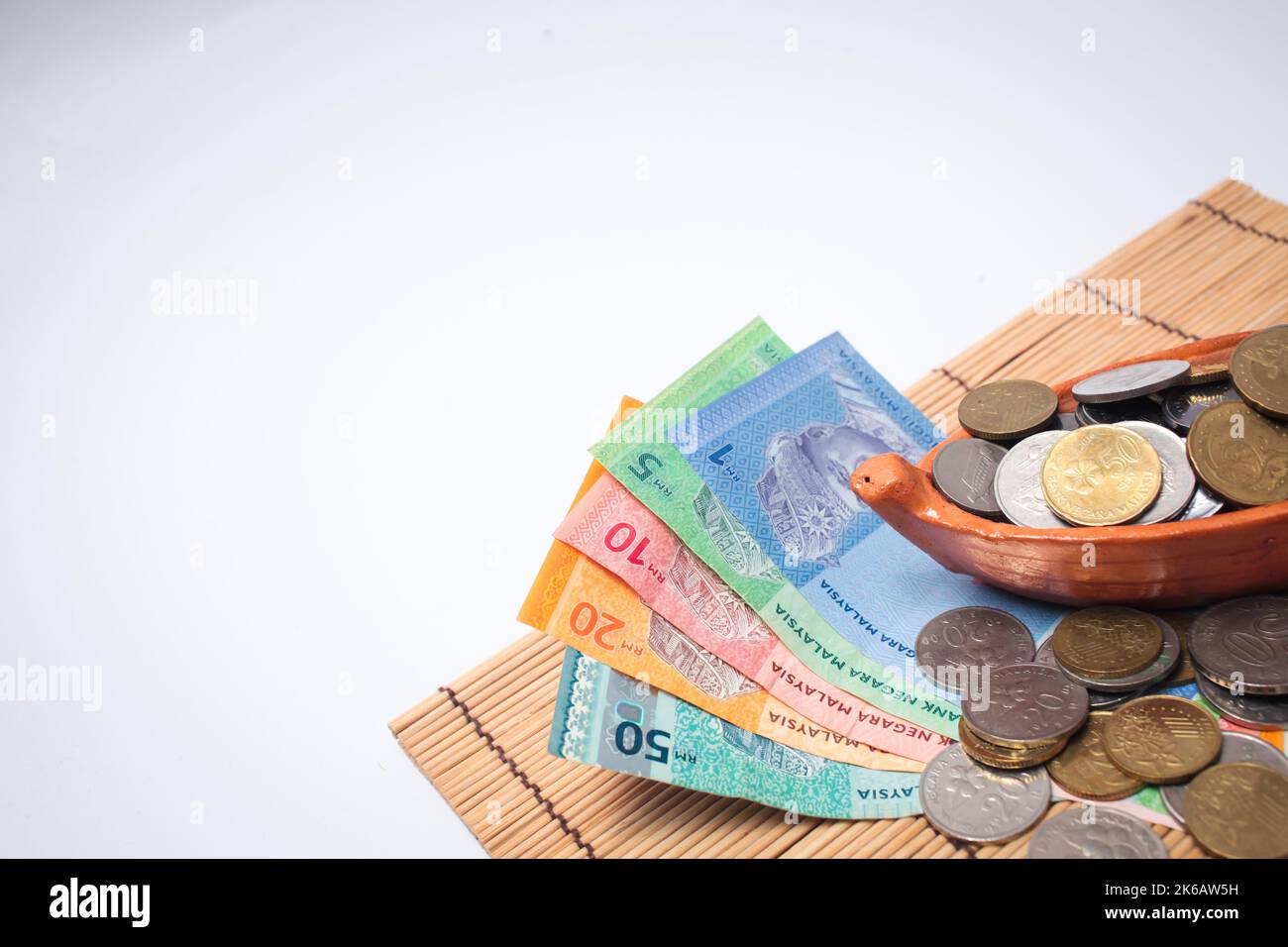 Malaysia Ringgit note and coins isolated on white background. Business ...