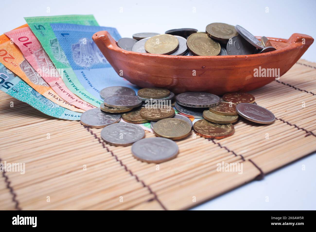 Malaysia Ringgit note and coins isolated on white background. Business ...