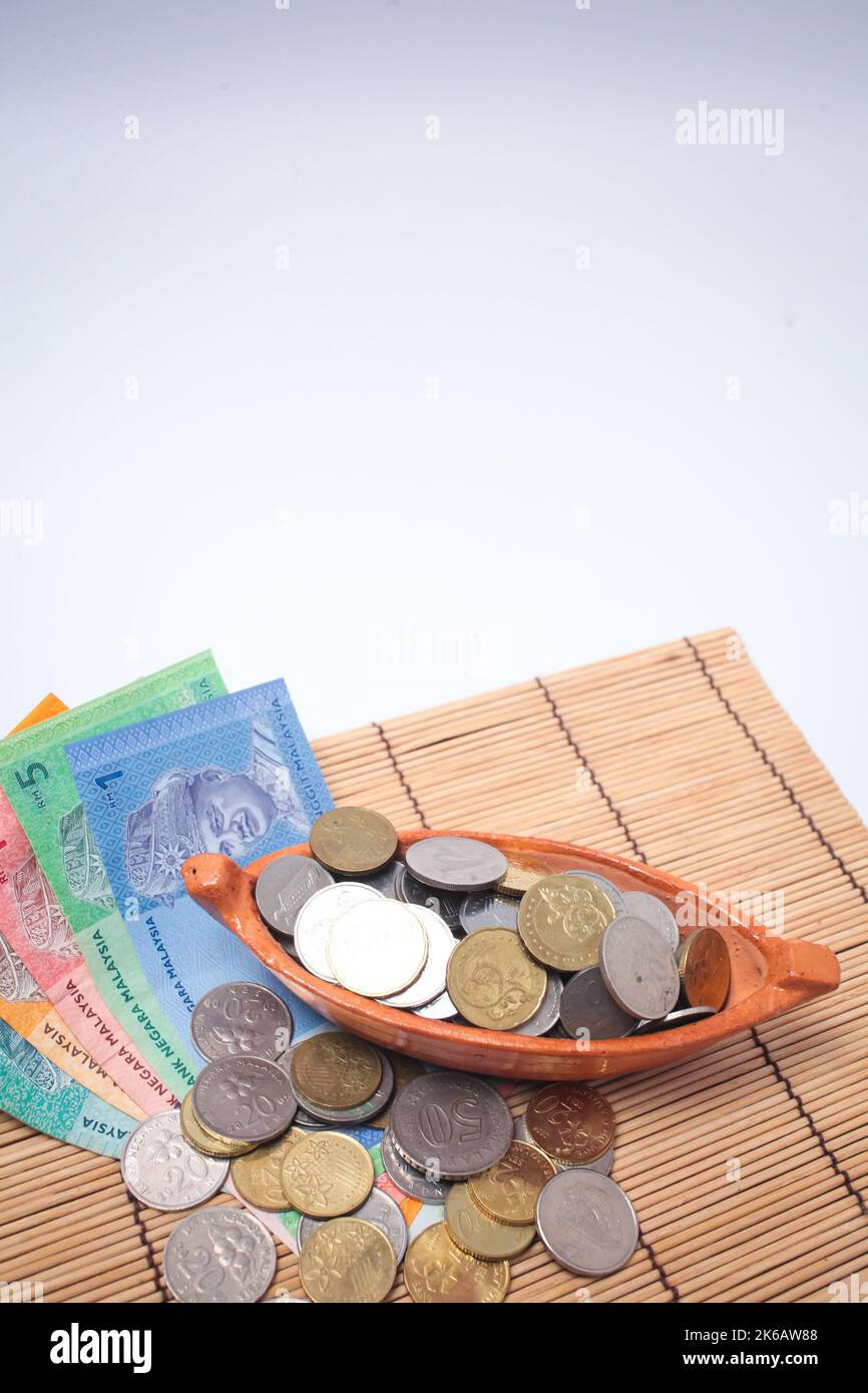 Malaysia Ringgit note and coins isolated on white background. Business ...
