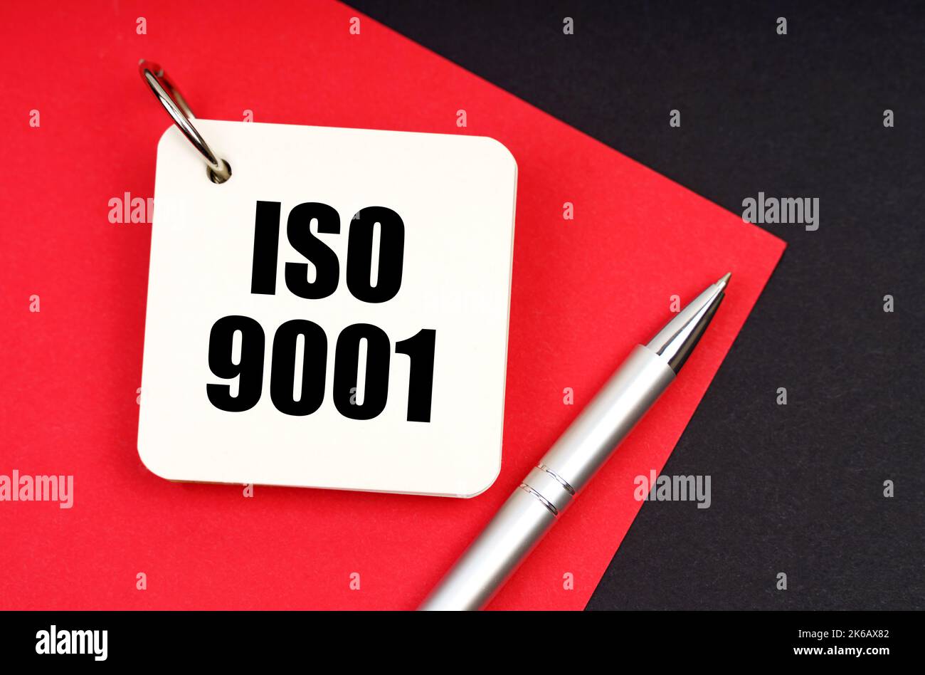 Industry and business concept. On a black and red background lies a pen ...