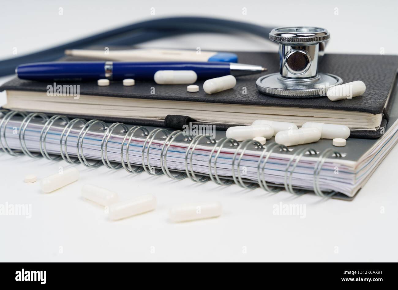 Medicine and health concept. On the table are a notebook, a stethoscope ...