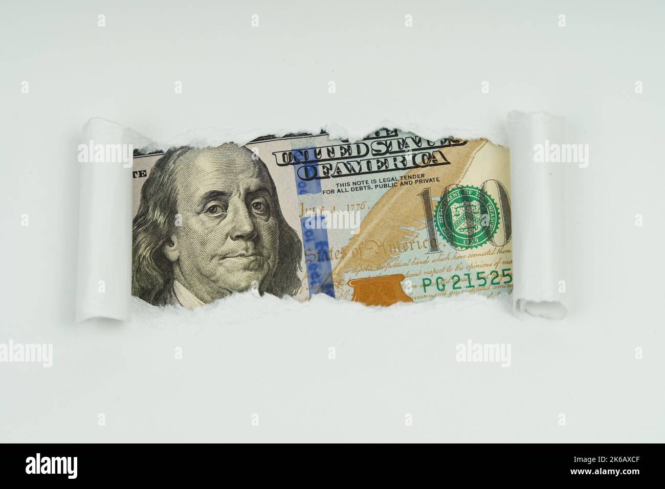 Business and finance concept. An image of a 100 dollar bill is visible ...