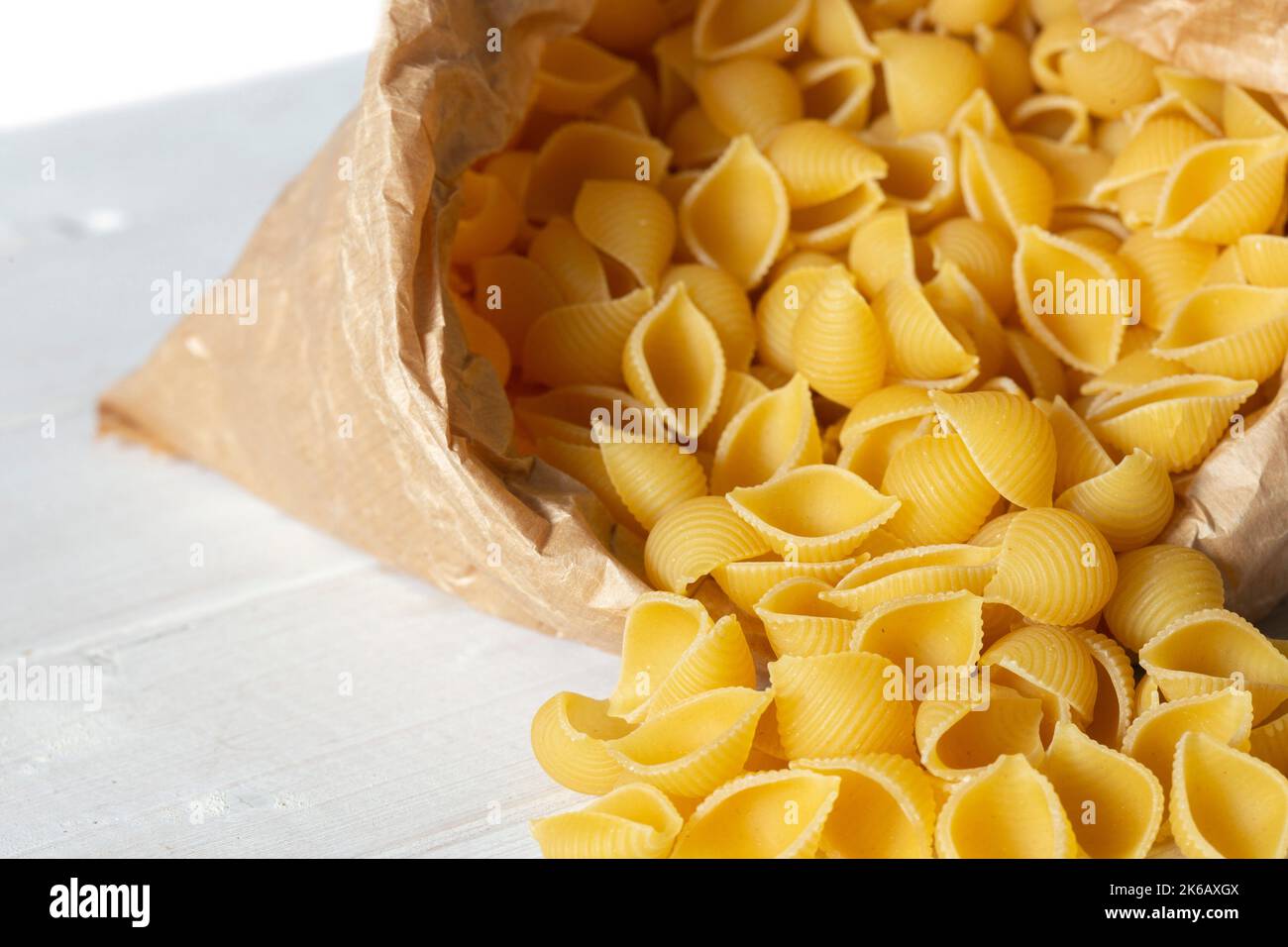 Conchiglie pasta shells in a brown paper bag. Eco-friendly recycling ...