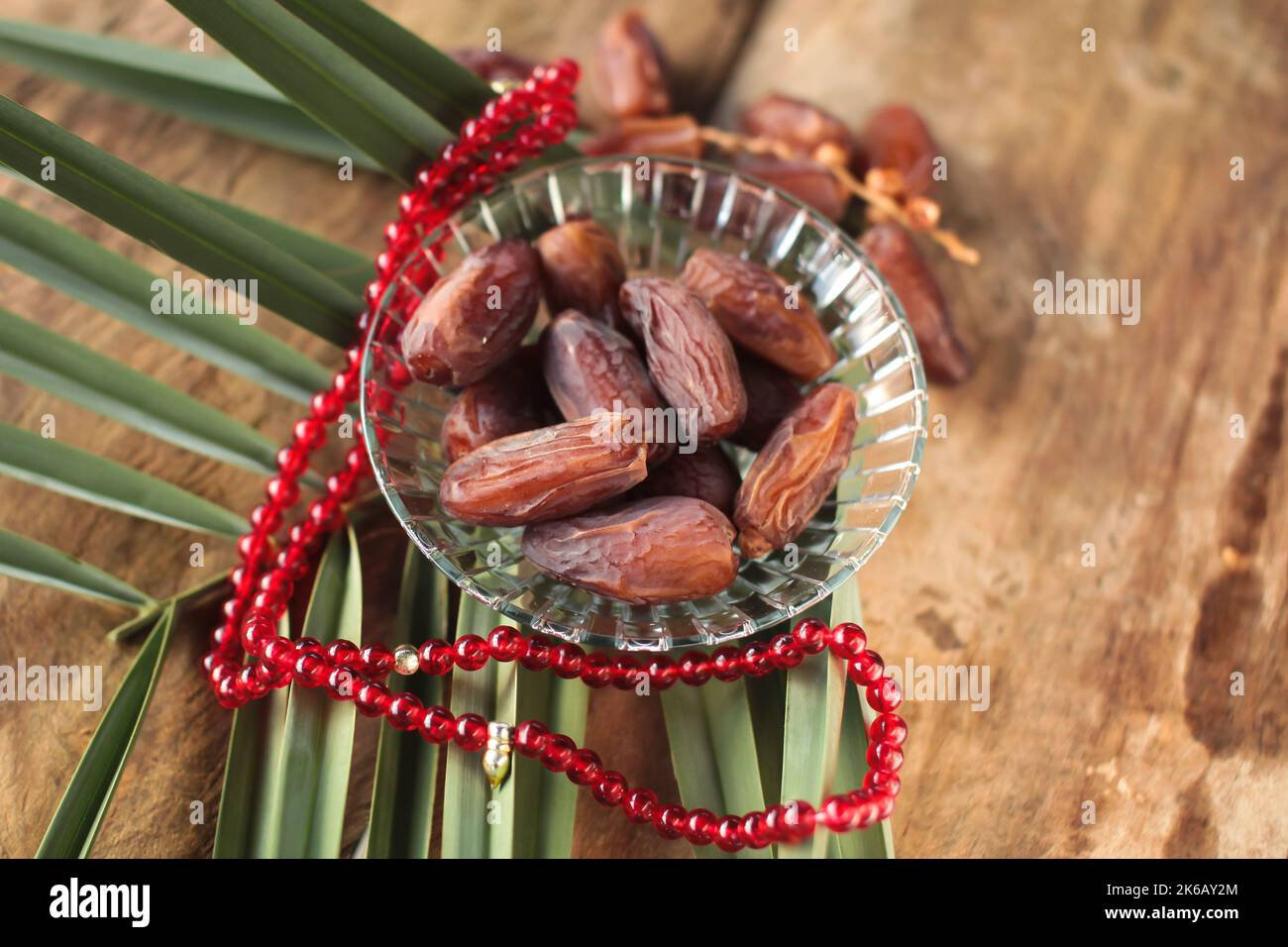 Dates or dattes palm fruit in wooden bowl is snack healthy Stock Photo ...