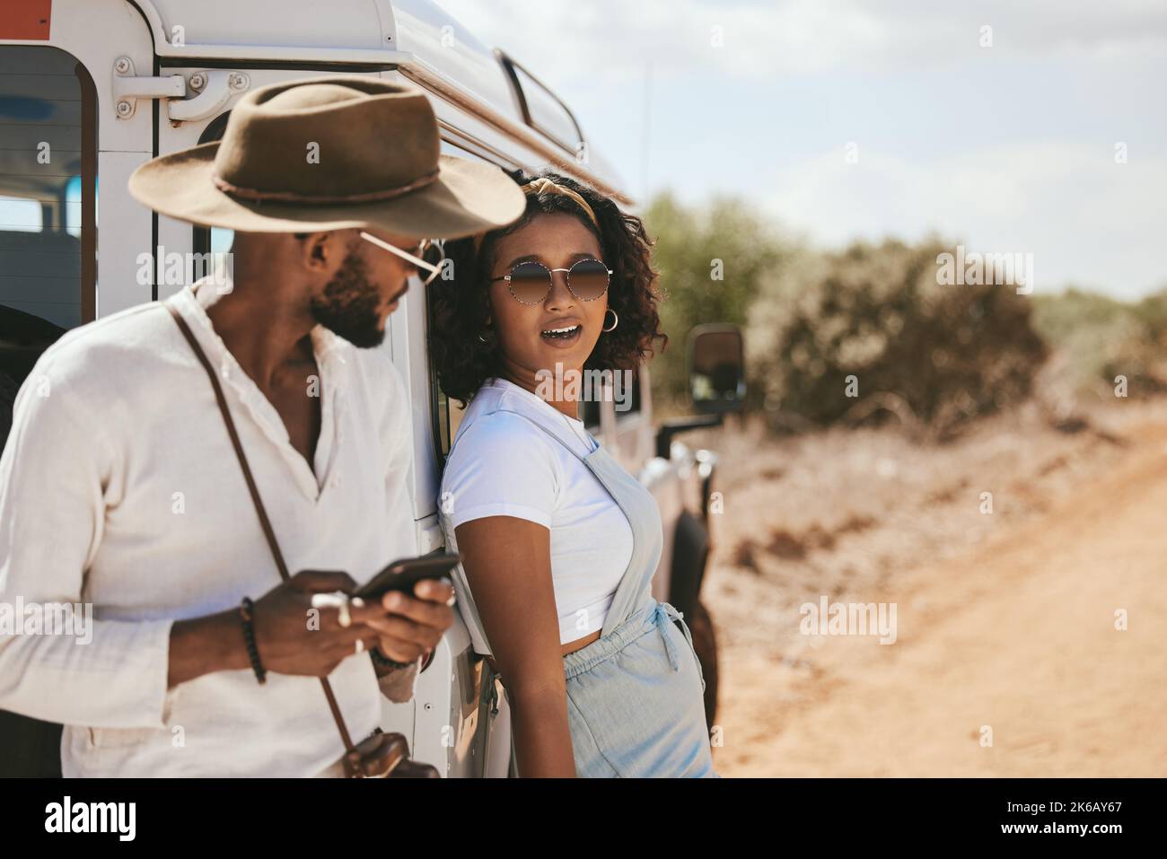 Road trip, travel and black people with smartphone for safari guide app ...