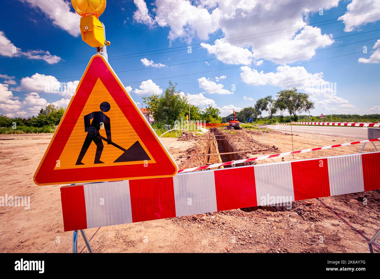 Sign with boundary and blink light signal are symbols of caution at ...