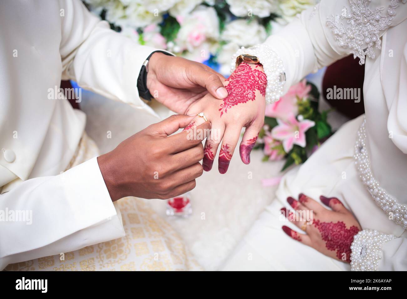 Wedding engagement rings. Married couple exchange wedding rings at a ...