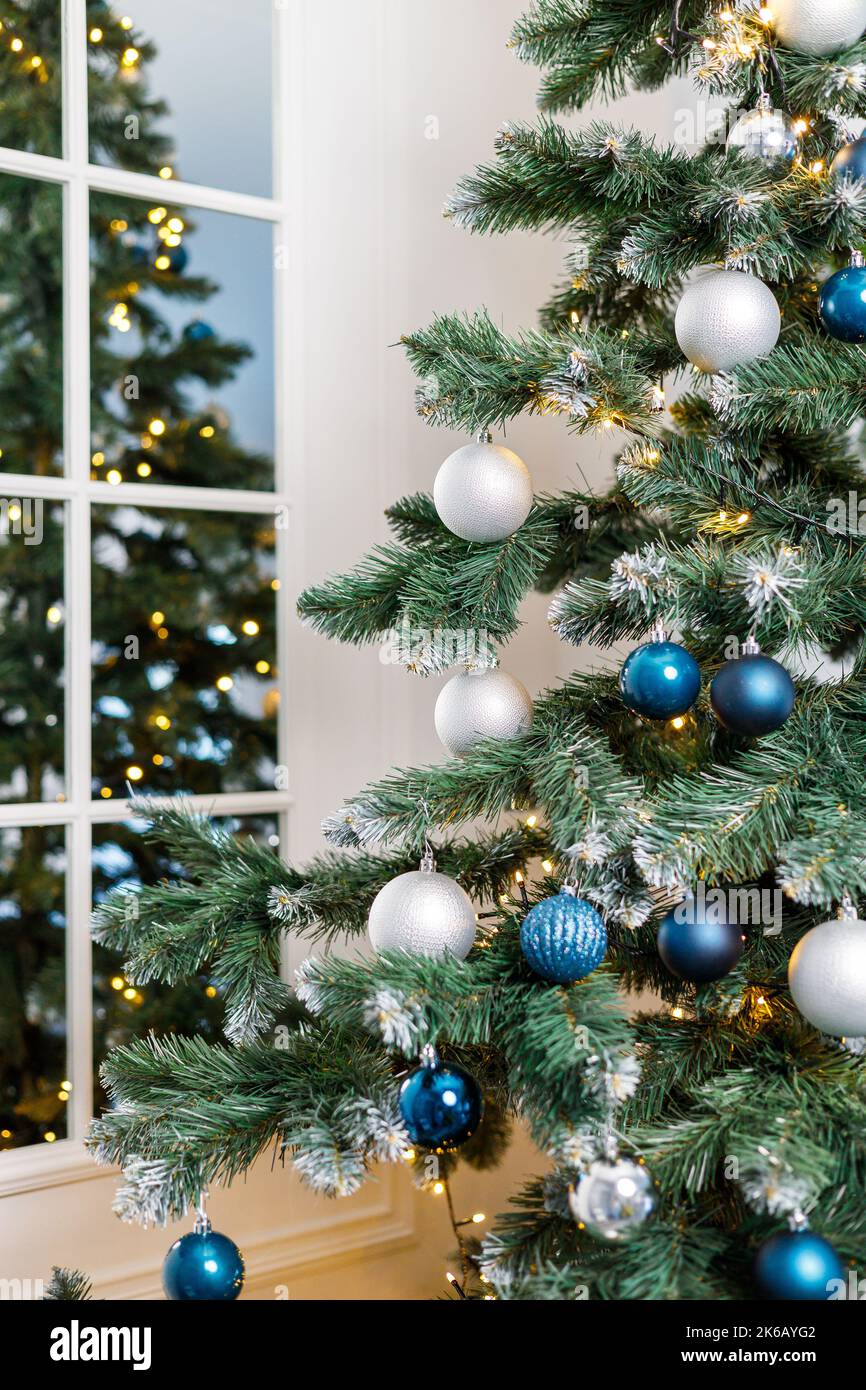 Christmas tree with blue and silver toys. Festively decorated Christmas ...