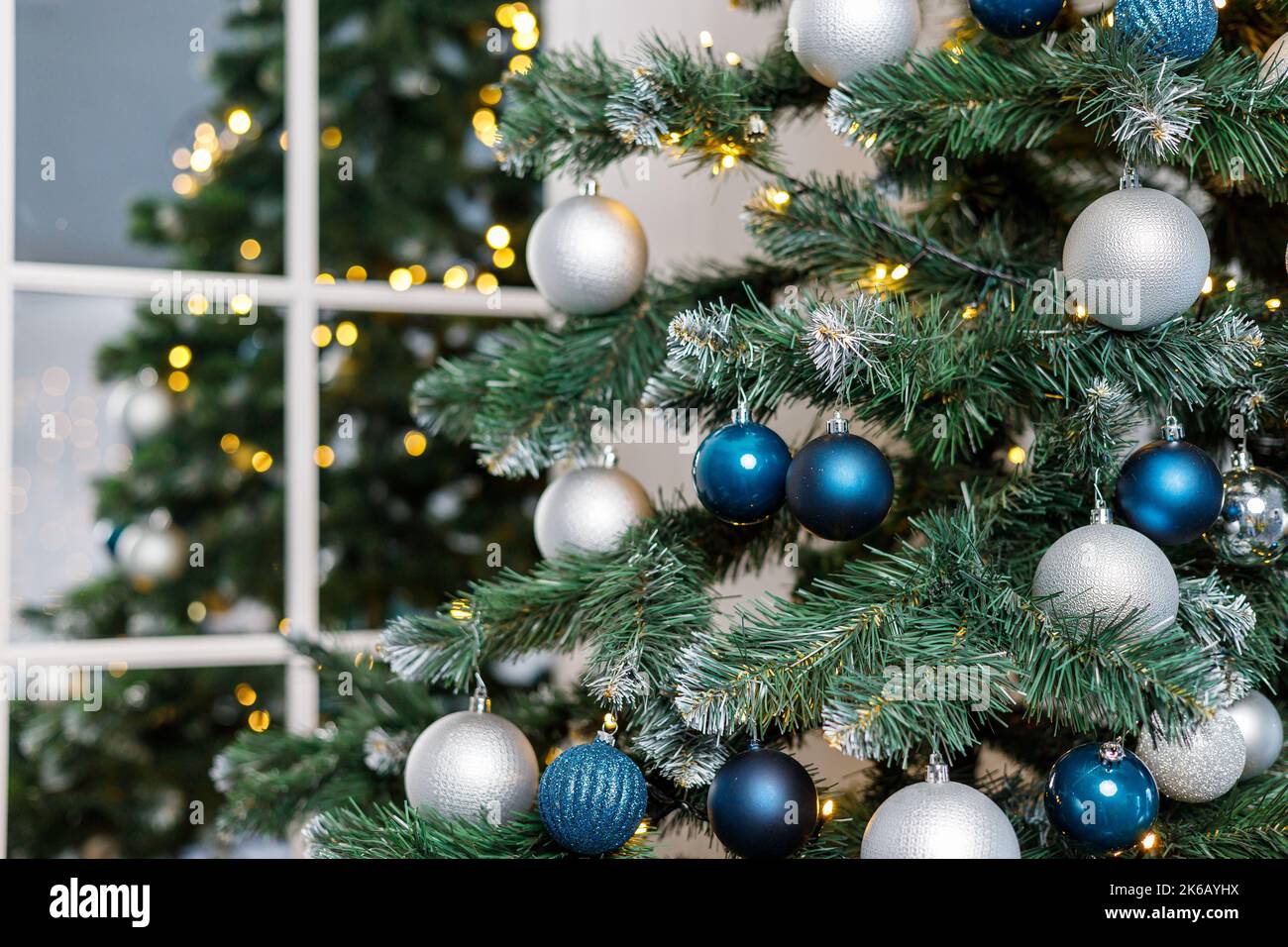 Christmas tree with blue and silver toys. Festively decorated Christmas ...