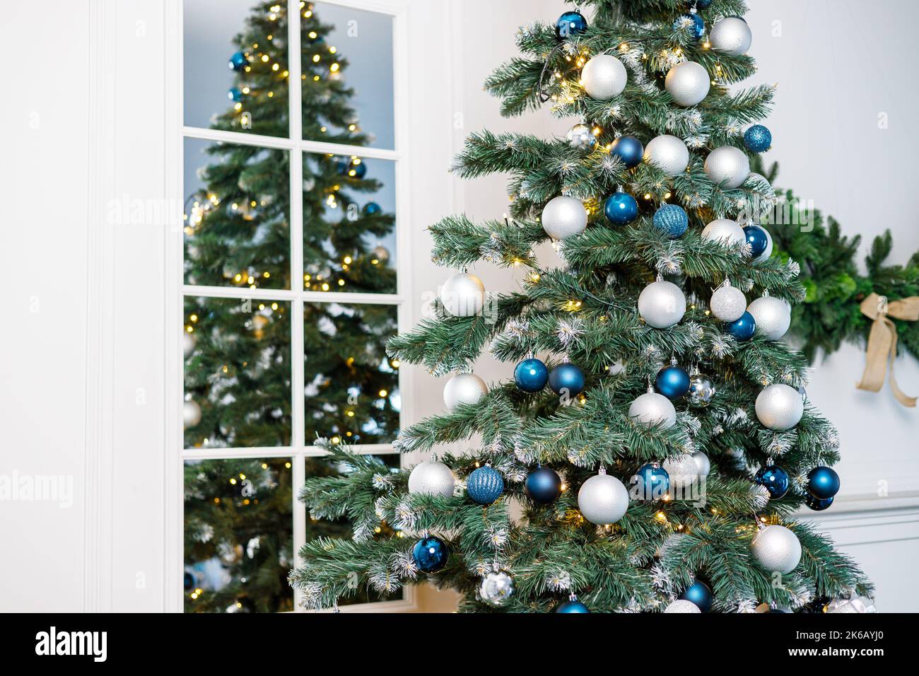 Christmas tree with blue and silver toys. Festively decorated Christmas ...