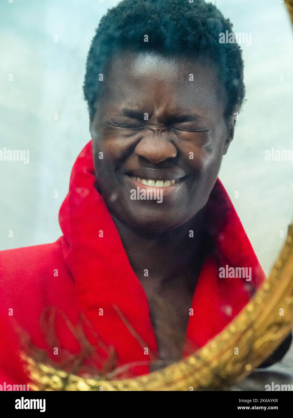 african black model reflection in a gothic golden mirror Stock Photo ...