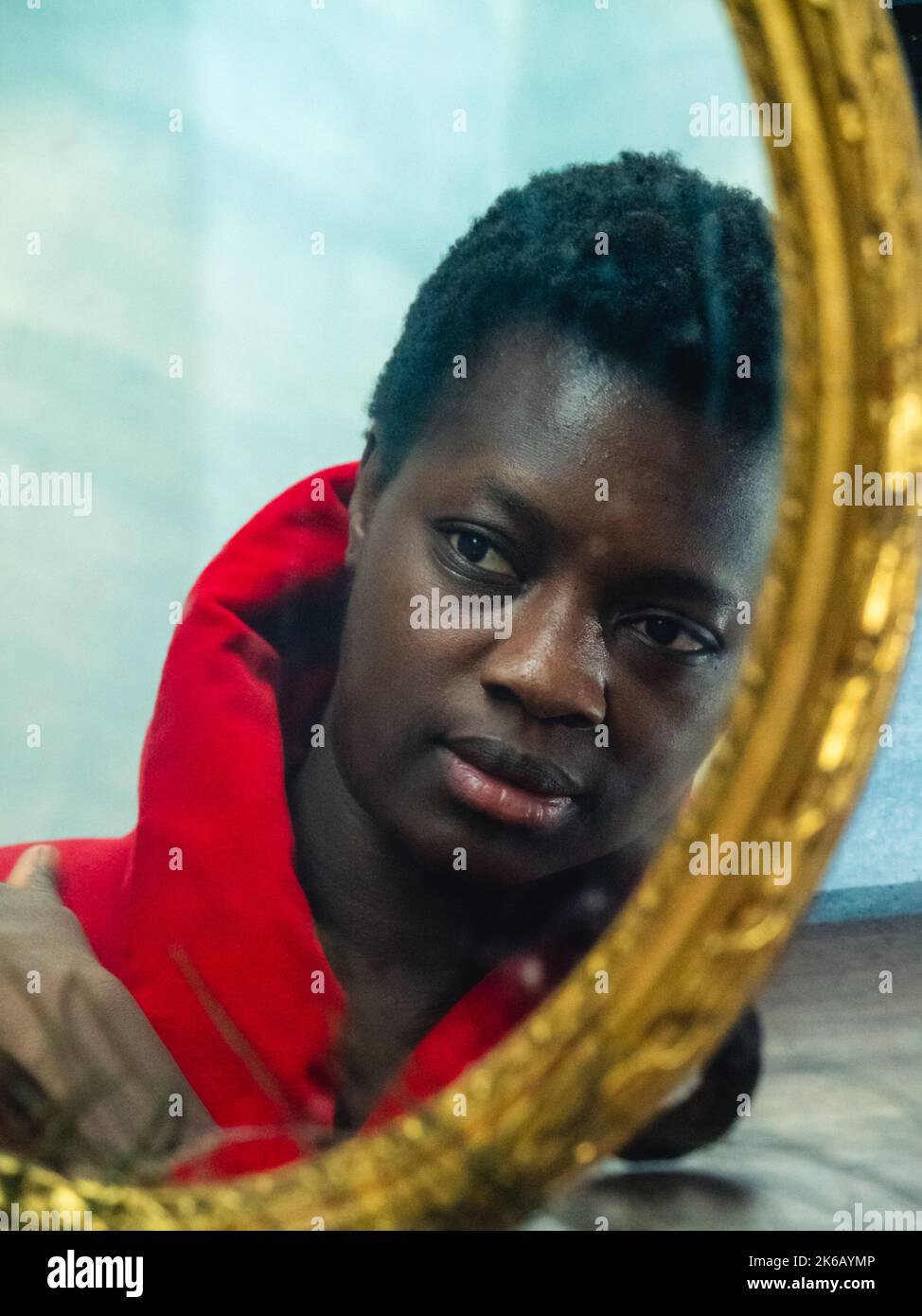 african black model reflection in a gothic golden mirror Stock Photo ...