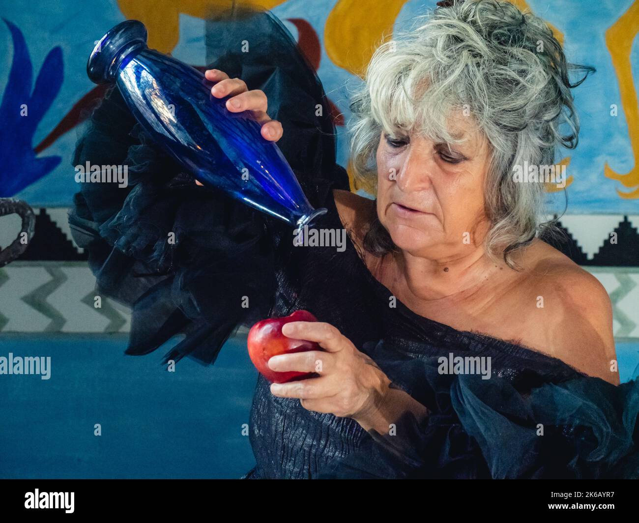 witchy preparing poisoned apple for victim as dark evil spell for ...