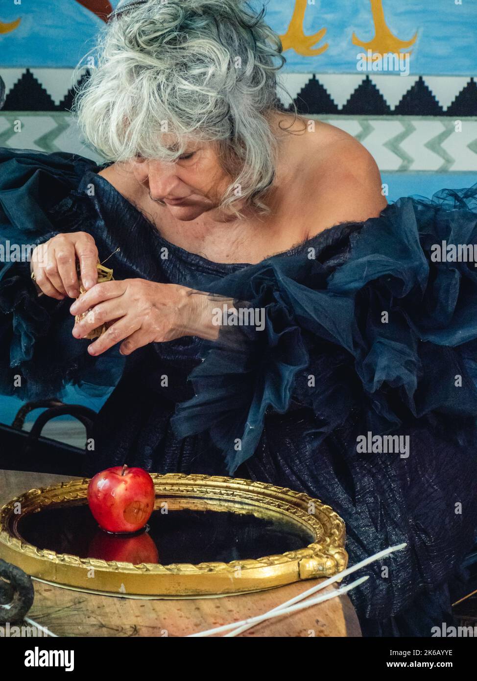 witchy preparing poisoned apple for victim as dark evil spell for ...