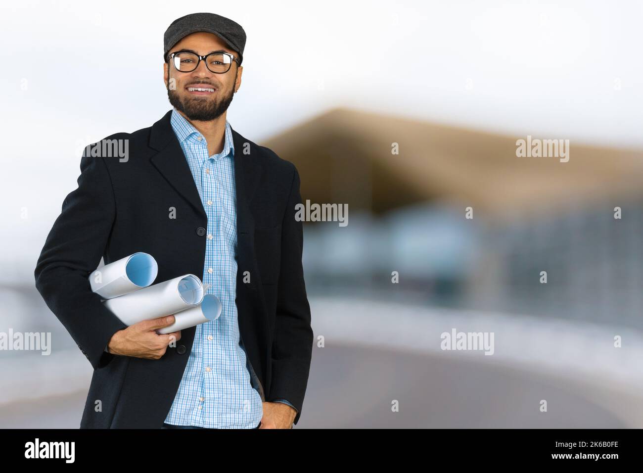 Smiling portrait of black architect engineer designer with construction ...