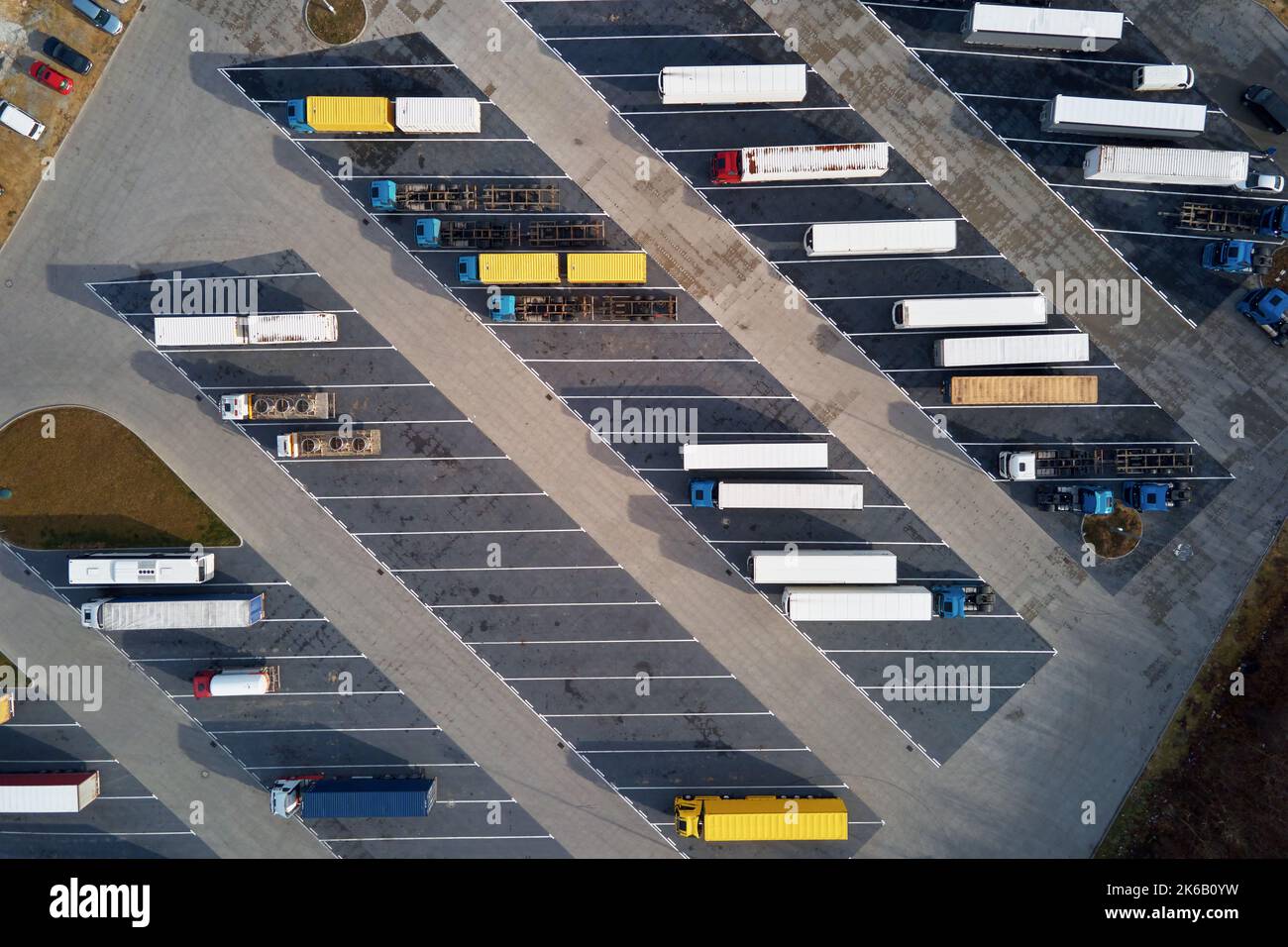 Top view of semi trucks waiting for loading at parking lot at logistic ...