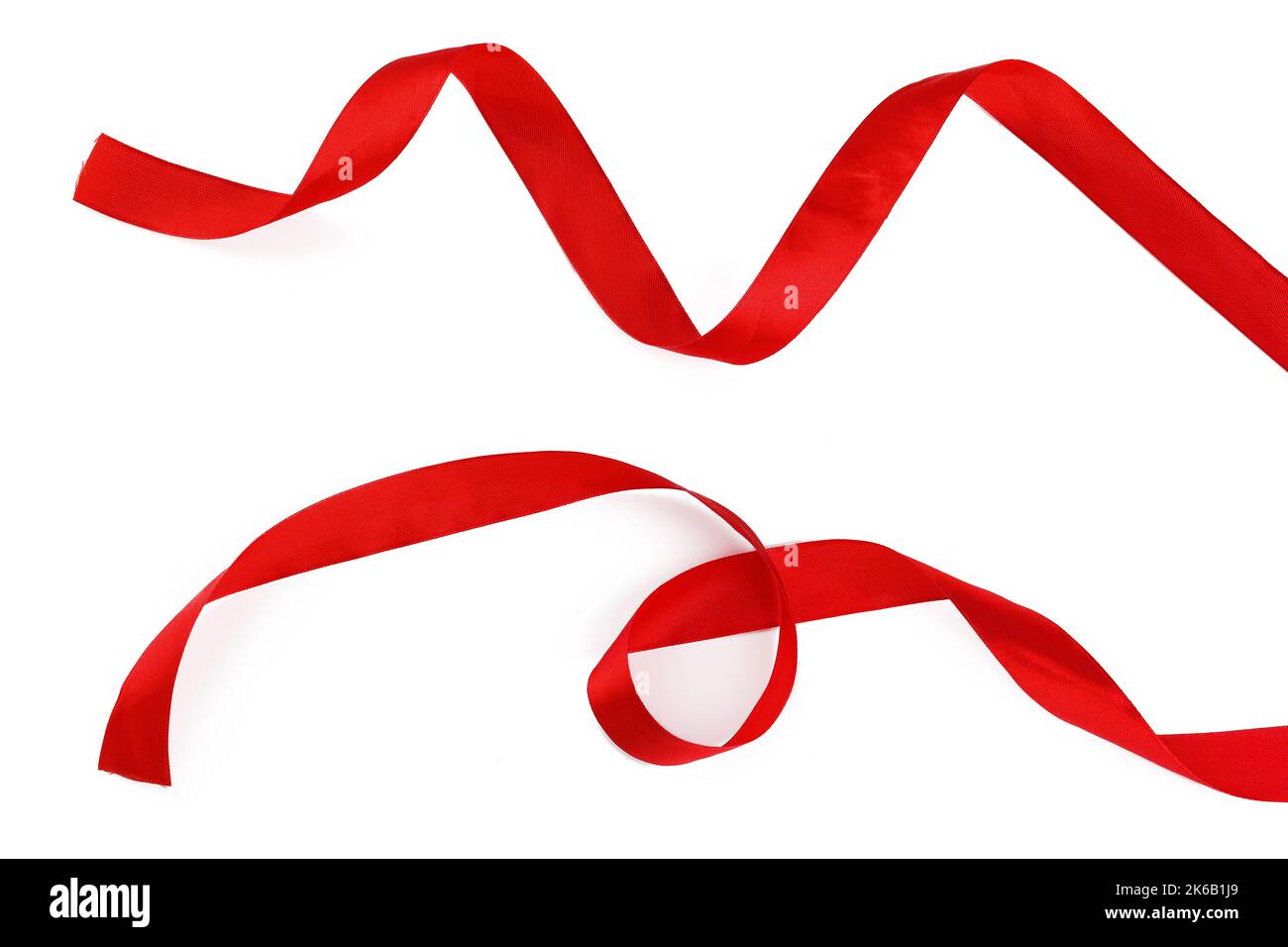 Shiny red satin ribbon isolated on white background Stock Photo - Alamy