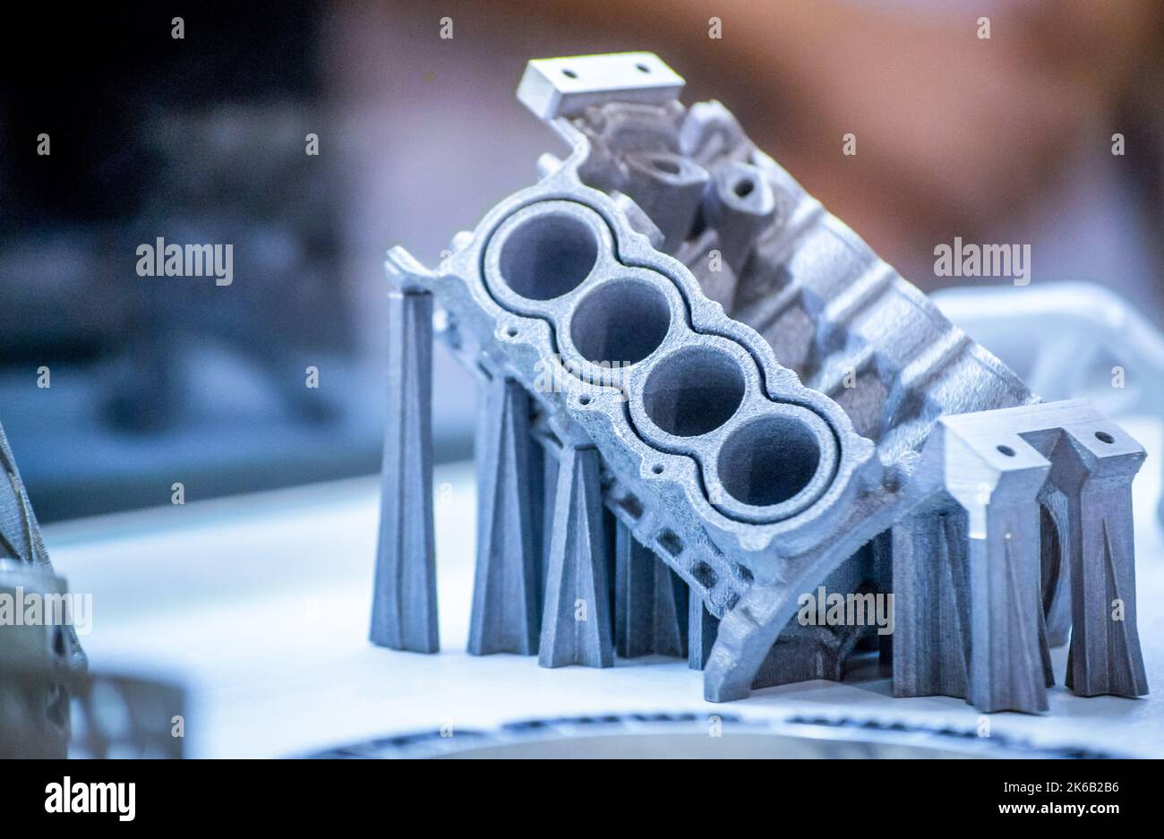 Man is holding object printed on metal 3d printer. Object printed in ...