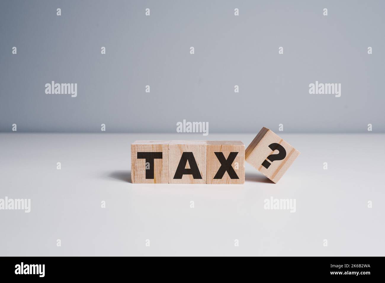 Wooden blocks with the word Tax and a question mark. Business and ...