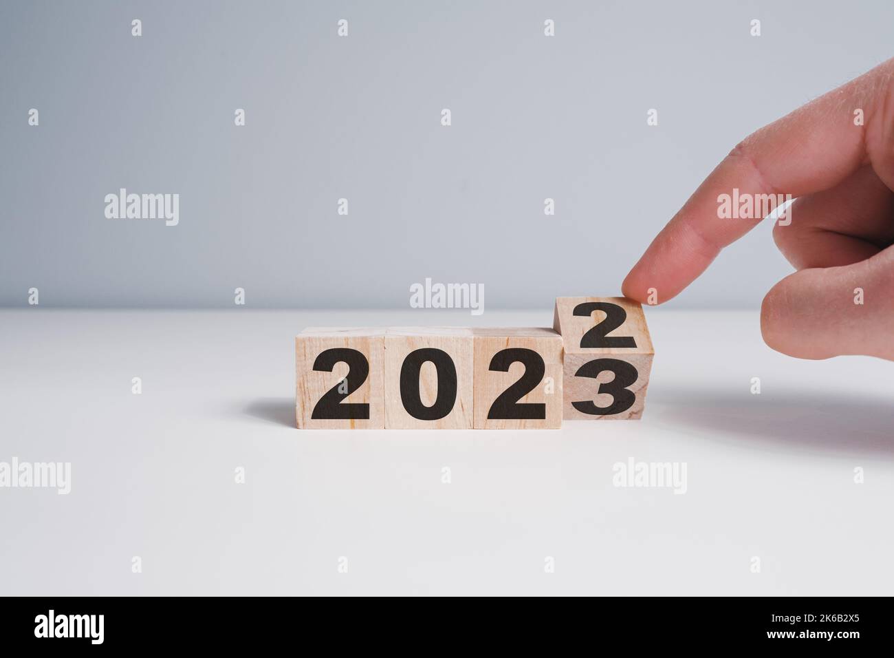 Wooden blocks with changing number 2022 2023. New year concept. Copy ...