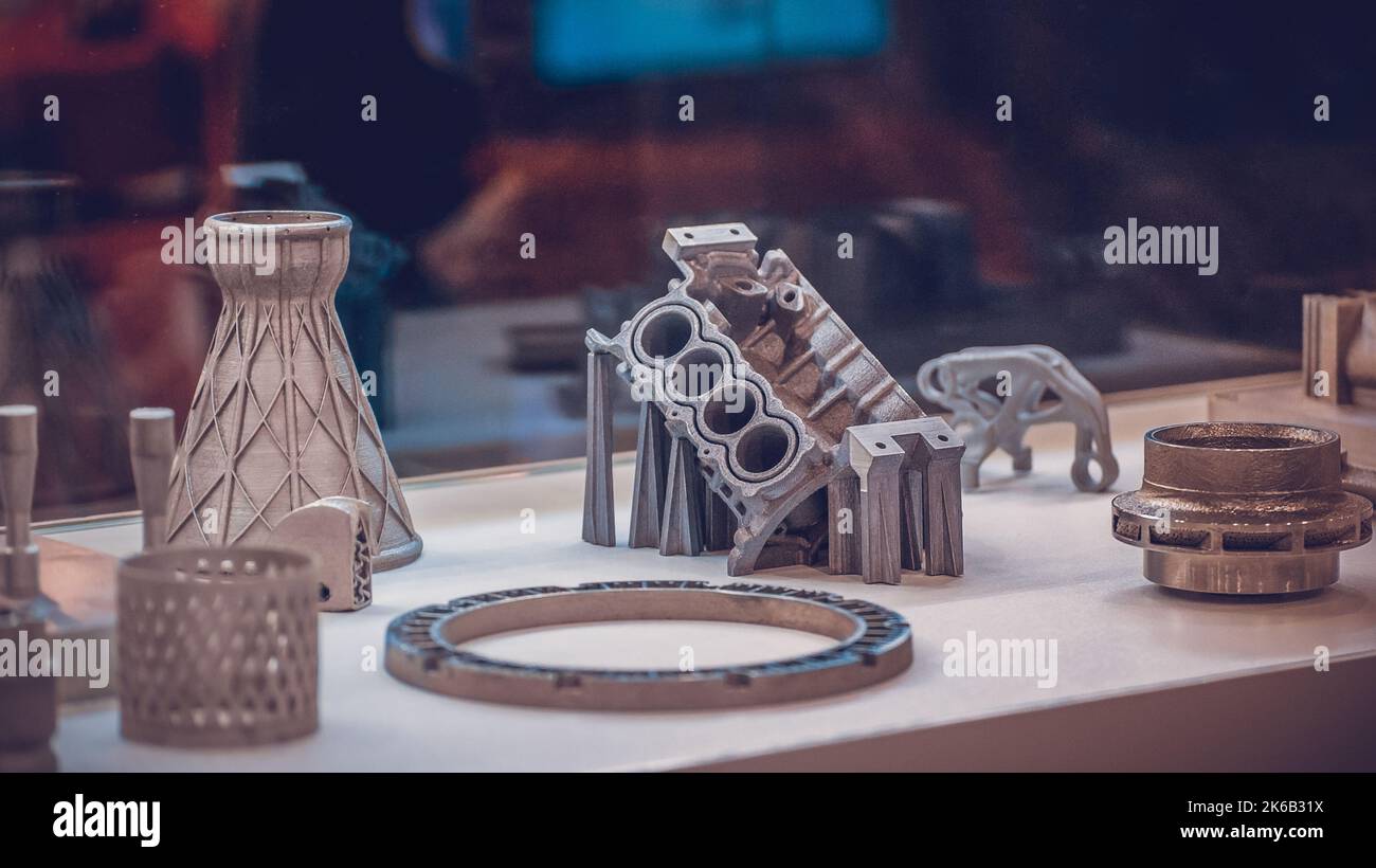 Man is holding object printed on metal 3d printer. Object printed in ...