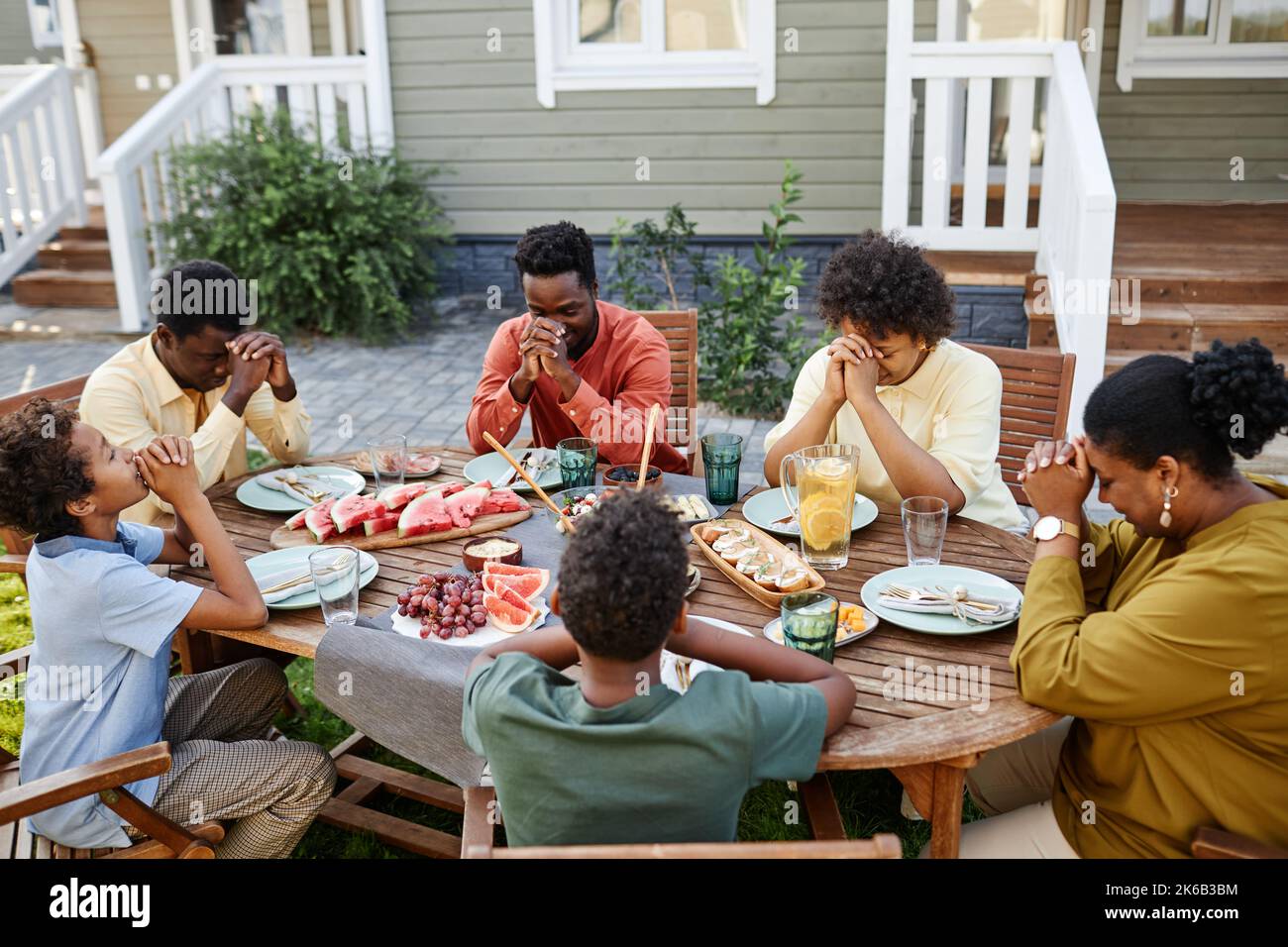 Woman mother praying table hi-res stock photography and images - Alamy
