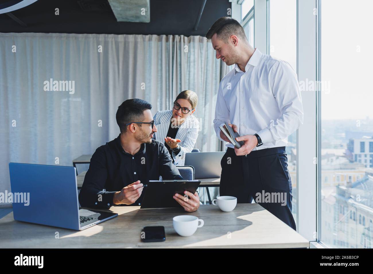 Caucasian male CEO businessman leader with team of diverse colleagues ...