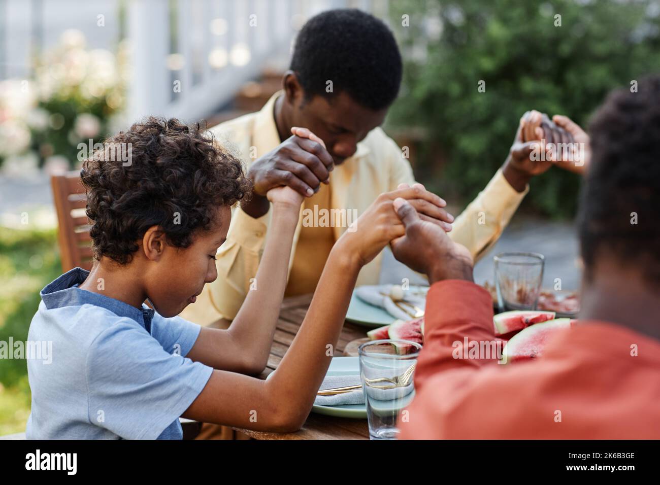 Black boy praying hi-res stock photography and images - Alamy