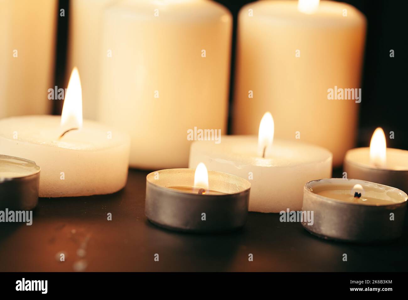 Many burning candles with shallow depth of field Stock Photo - Alamy