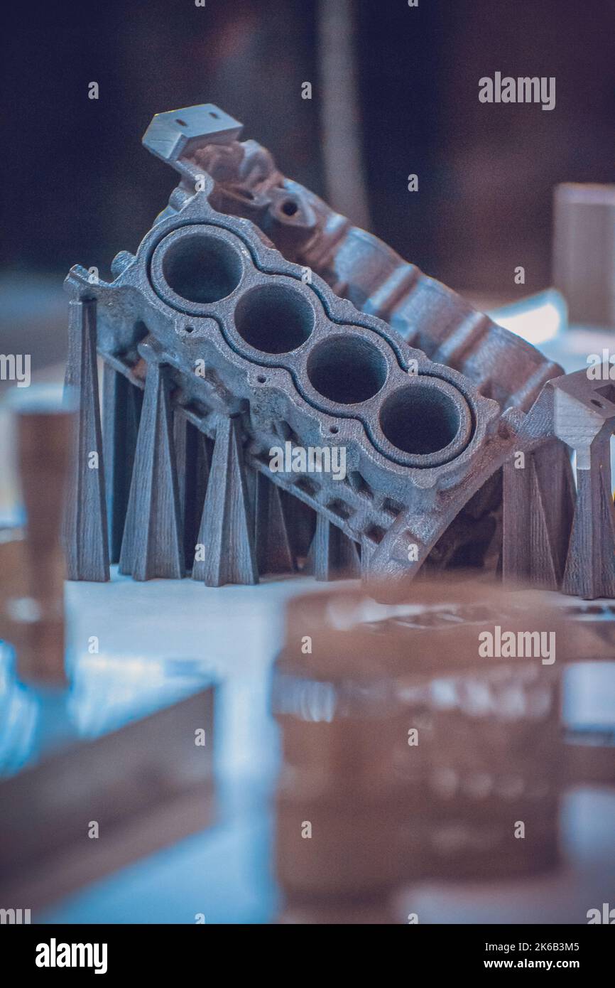 Man is holding object printed on metal 3d printer. Object printed in ...